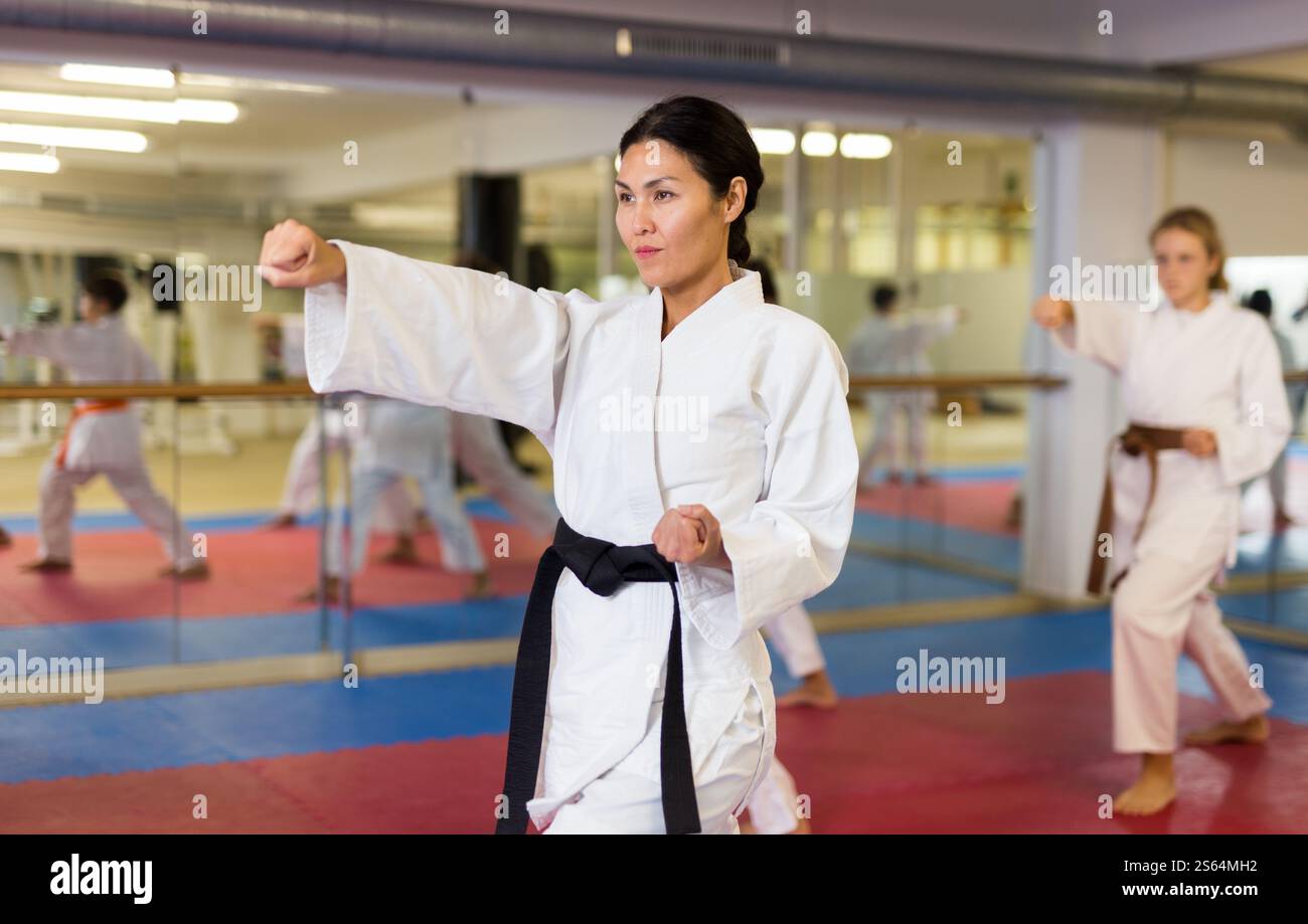 Karate trainer with kids Stock Photo - Alamy