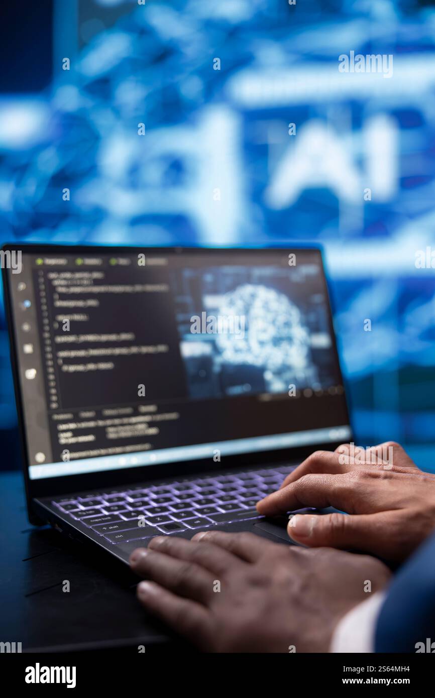 System administrator analyzing complex AI brain models on laptop. Close up shot of worker using ...