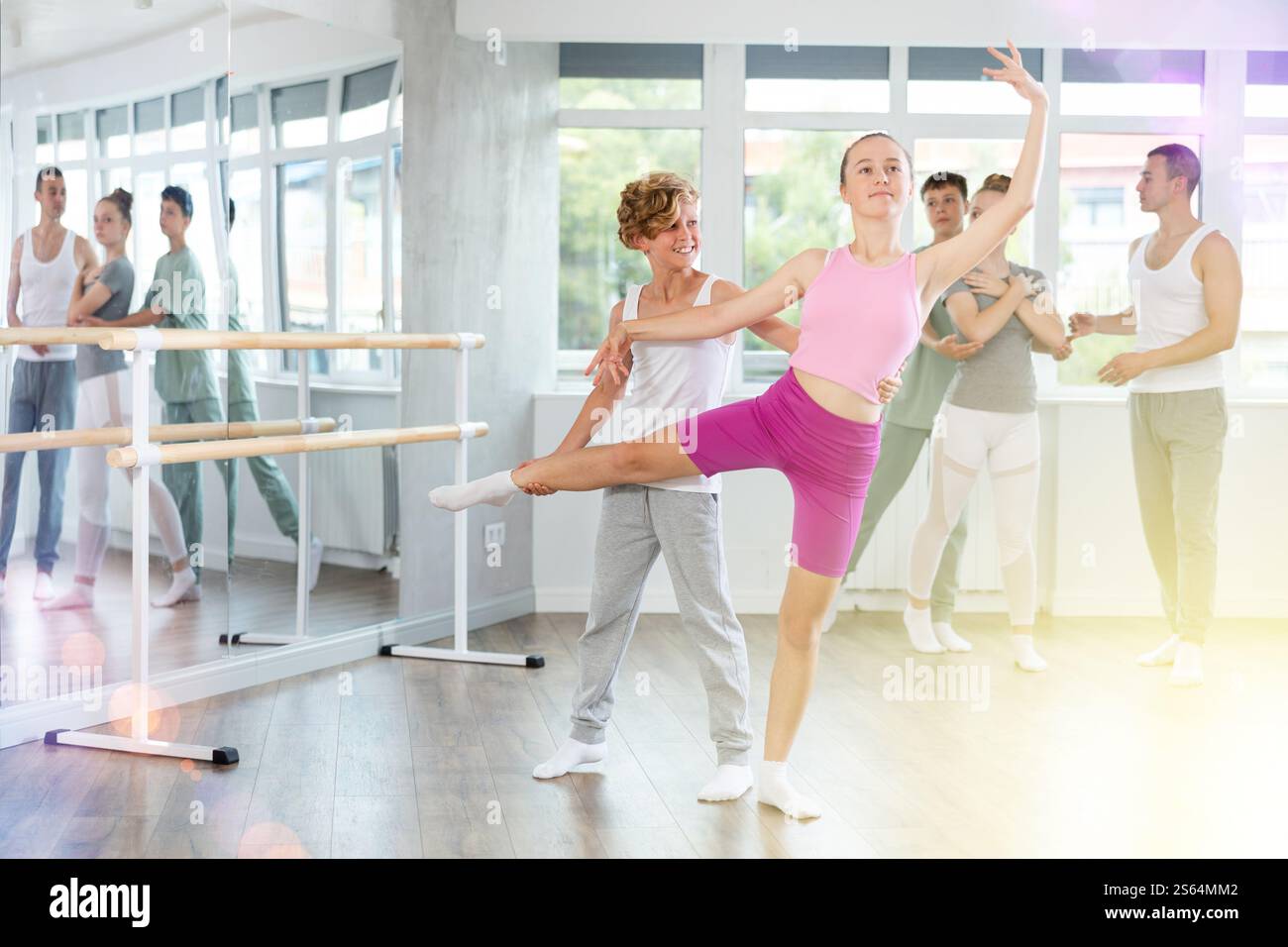 Boy and girl in pair train to perform ballet dance during rehearsal in ...