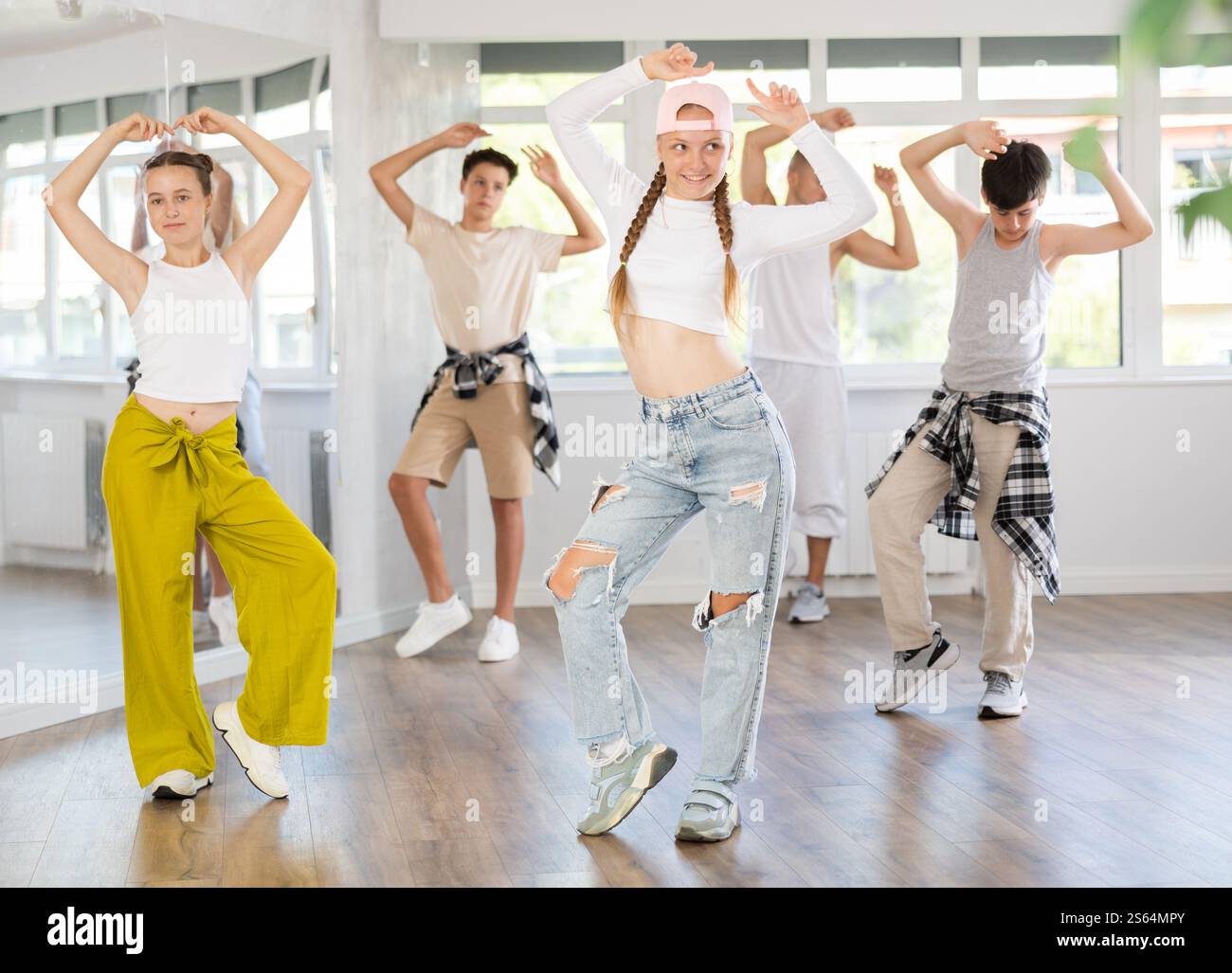 Teenage girl practicing basic hip hop moves in training hall Stock ...