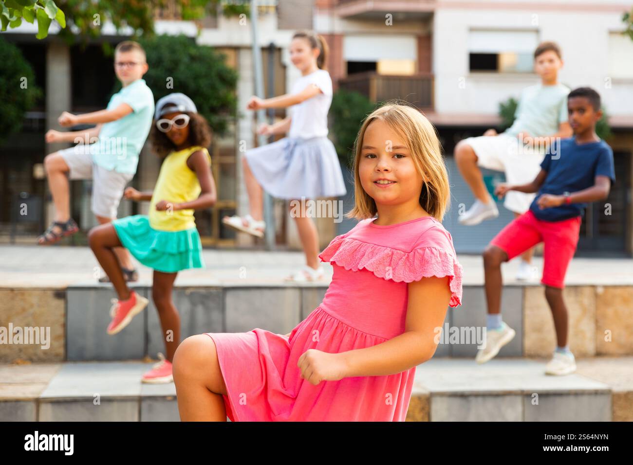Group of kids performing street dance outdoors Stock Photo - Alamy