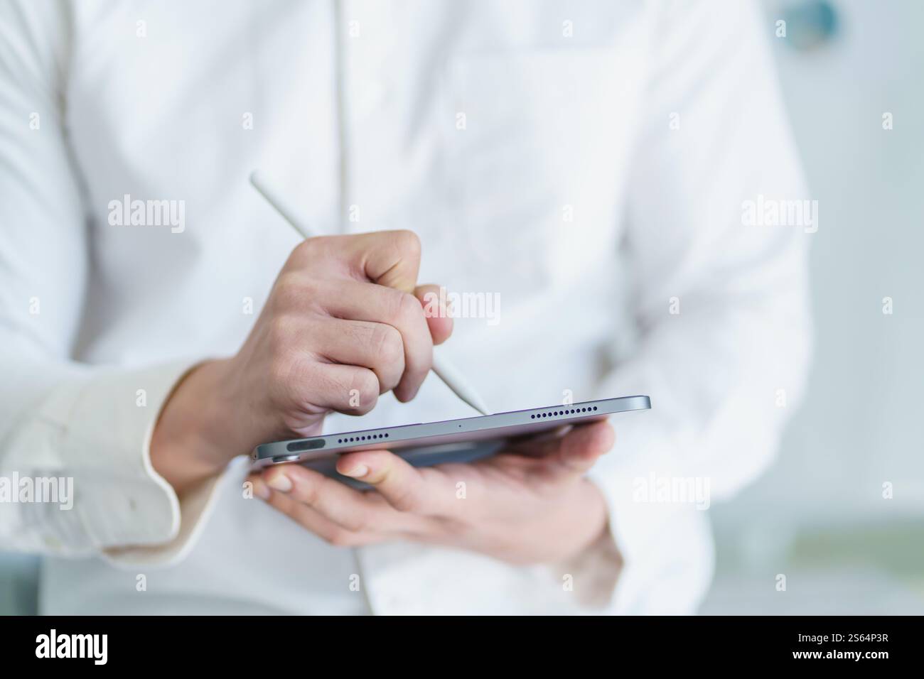 Businessman holding in hand tablet. hand pointing screen presented in ...