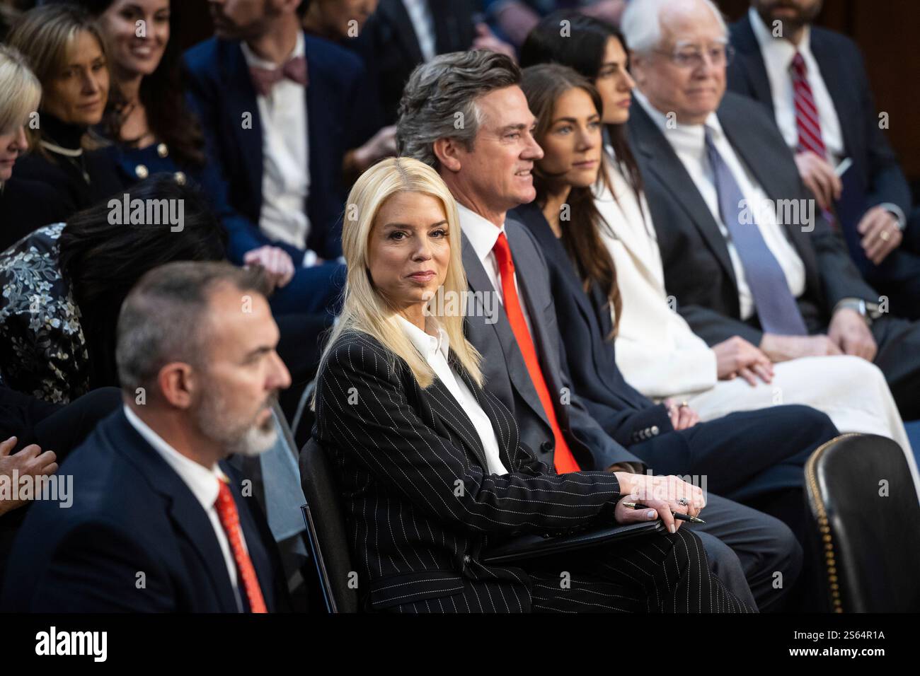 Pam Bondi, President-elect Donald Trump's nominee for attorney general, looks on before ...
