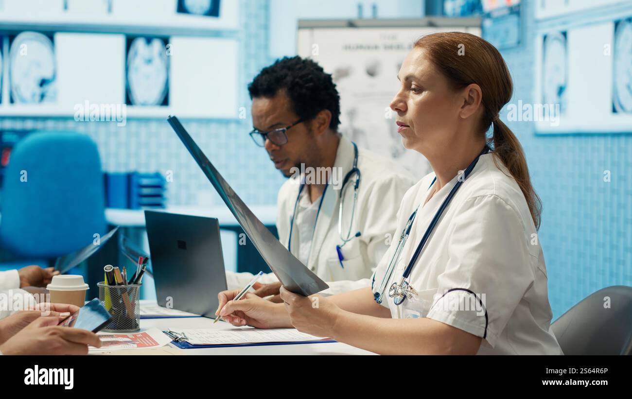 Medical expert reviews x ray results and discusses disease prevention ...