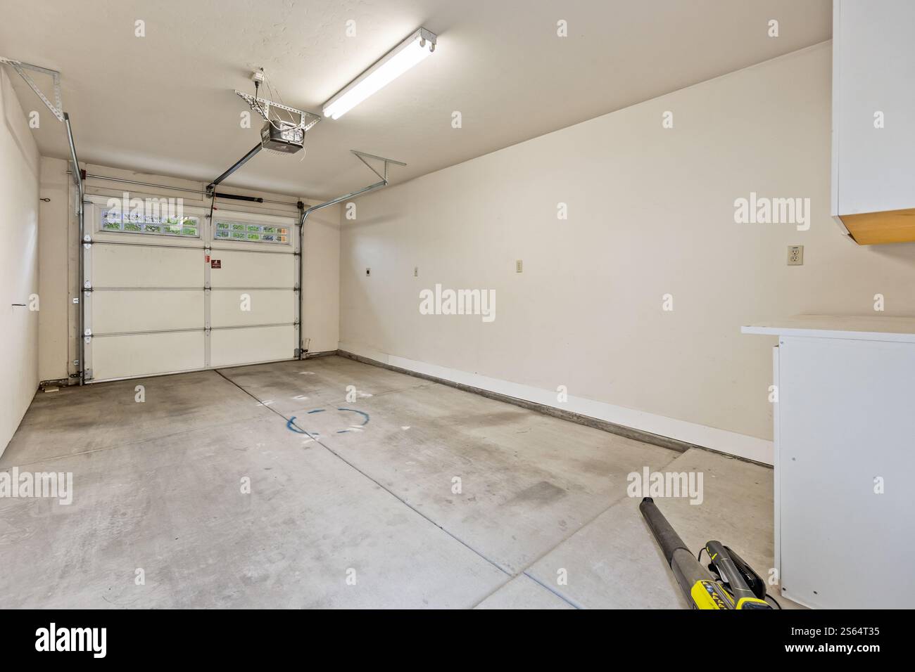 This large garage features a high wooden ceiling with exposed beams ...