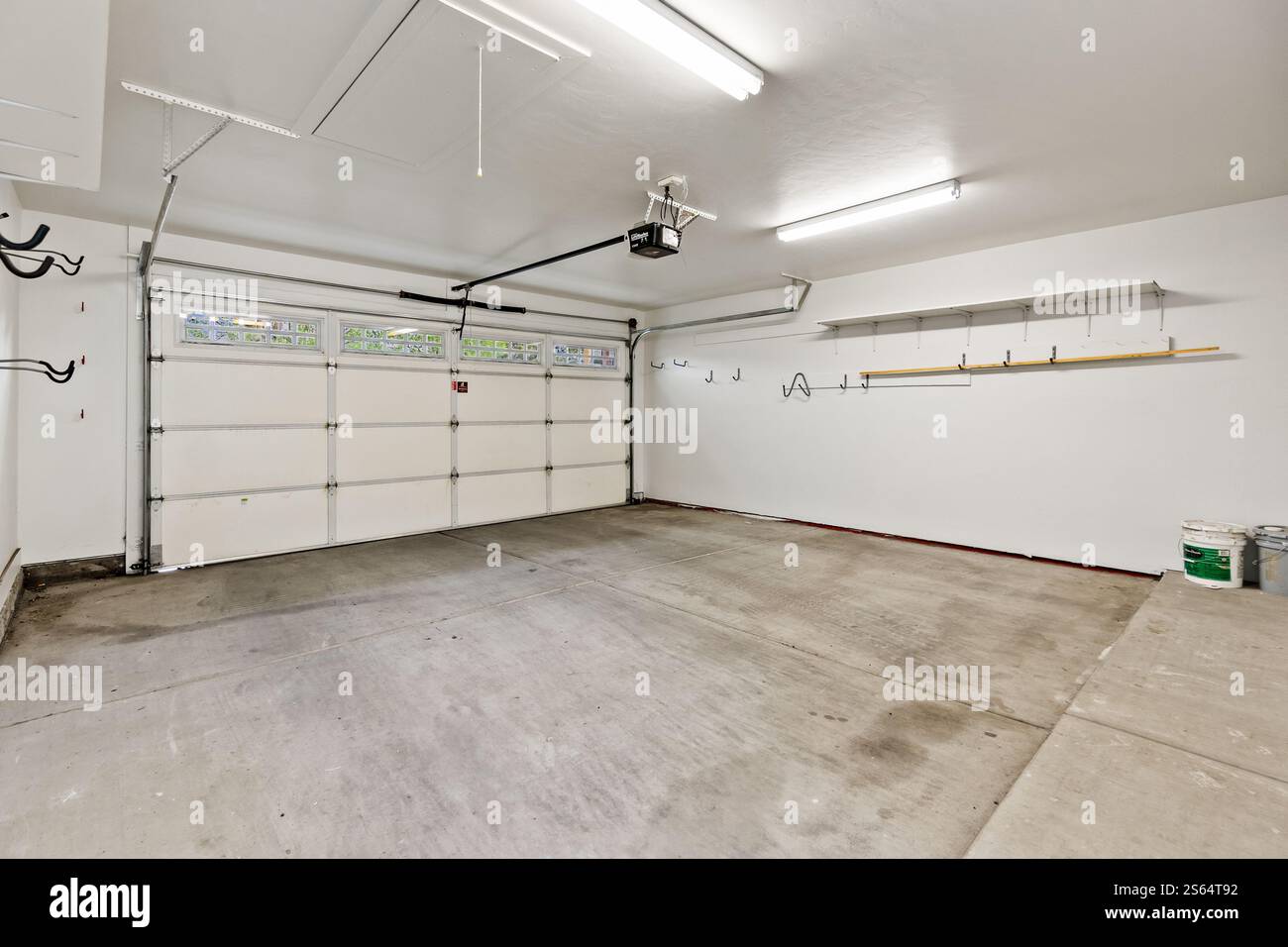 This large garage features a high wooden ceiling with exposed beams ...