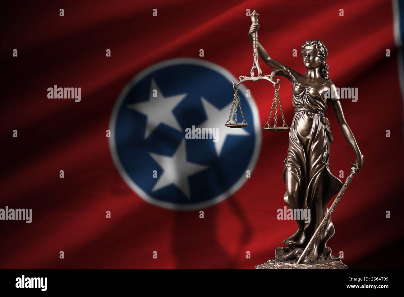 Tennessee US state flag with statue of lady justice and judicial scales ...