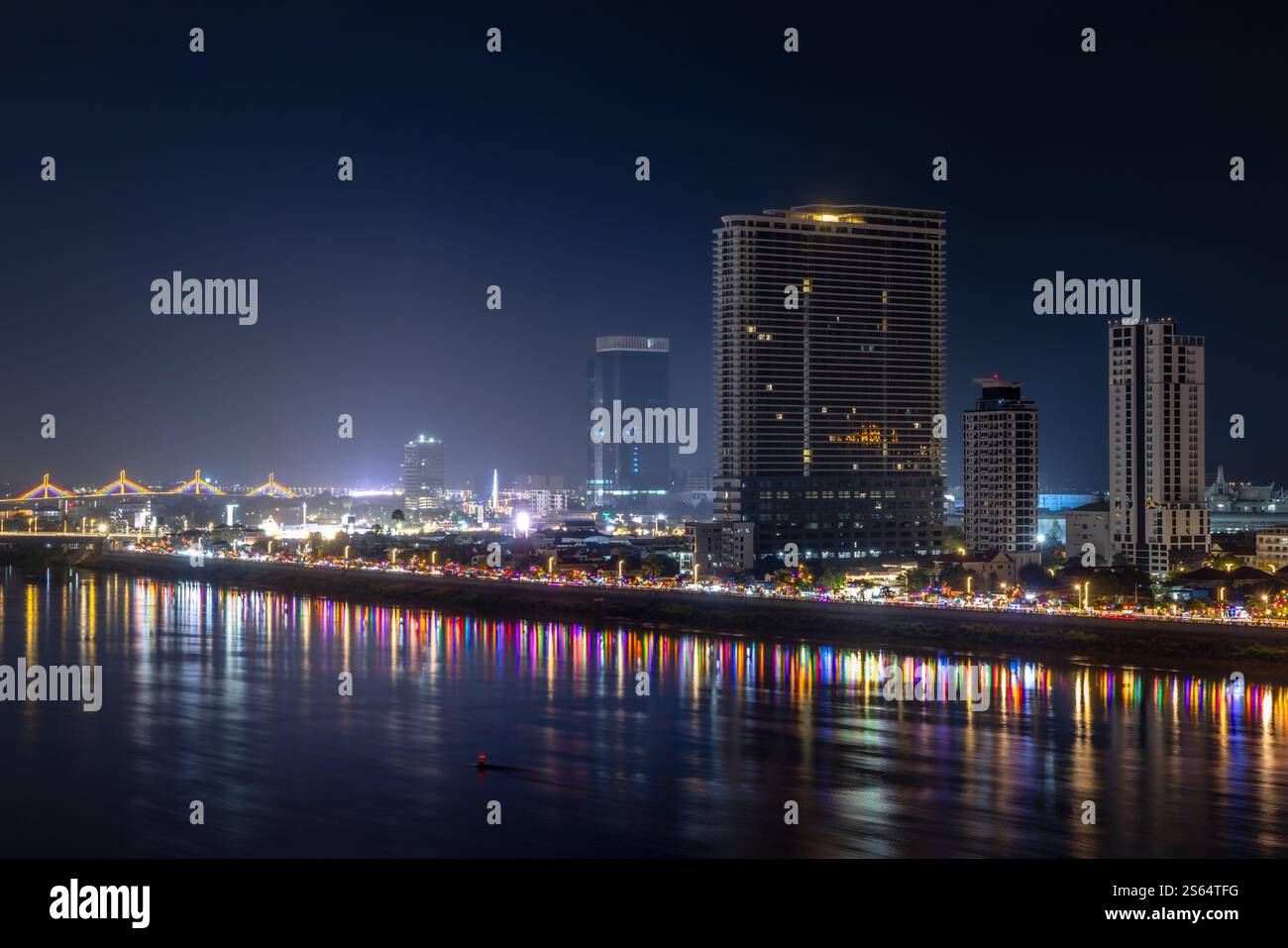 Tonle Sap river bank with modern buildings and residential areas ...