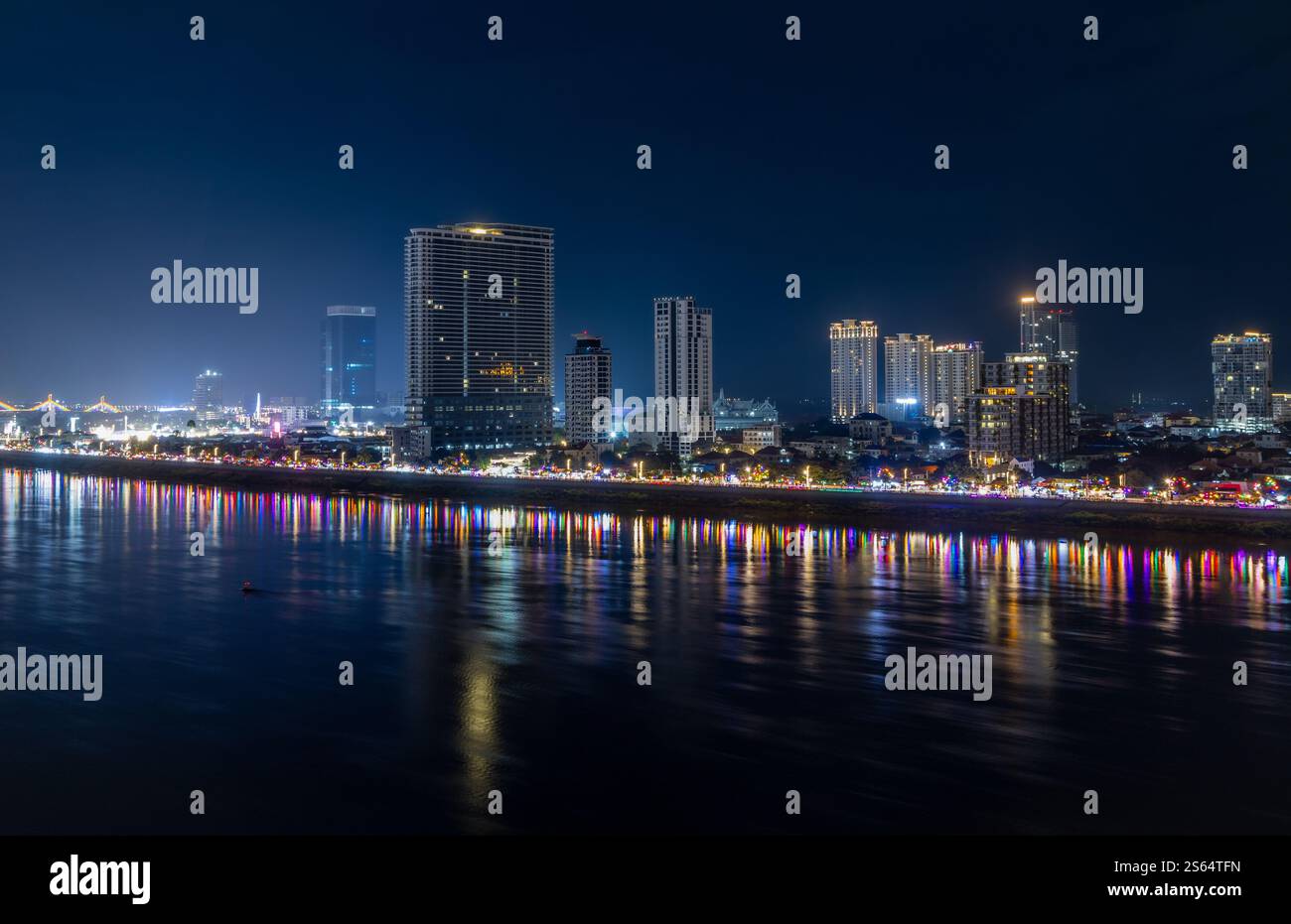 Tonle Sap river bank with modern buildings and residential areas ...