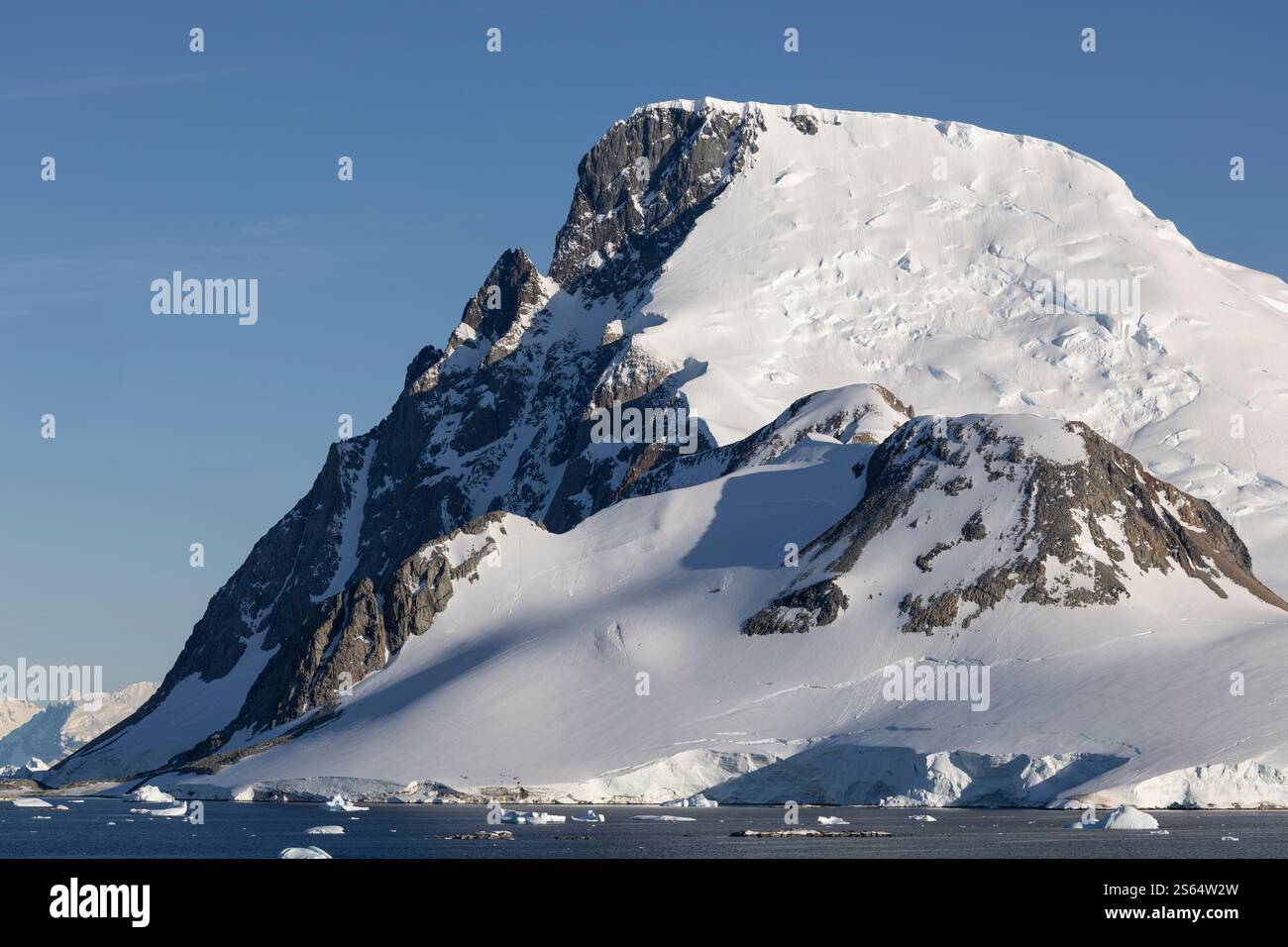 Large mountain rising out of the sea, Antarctica Stock Photo - Alamy
