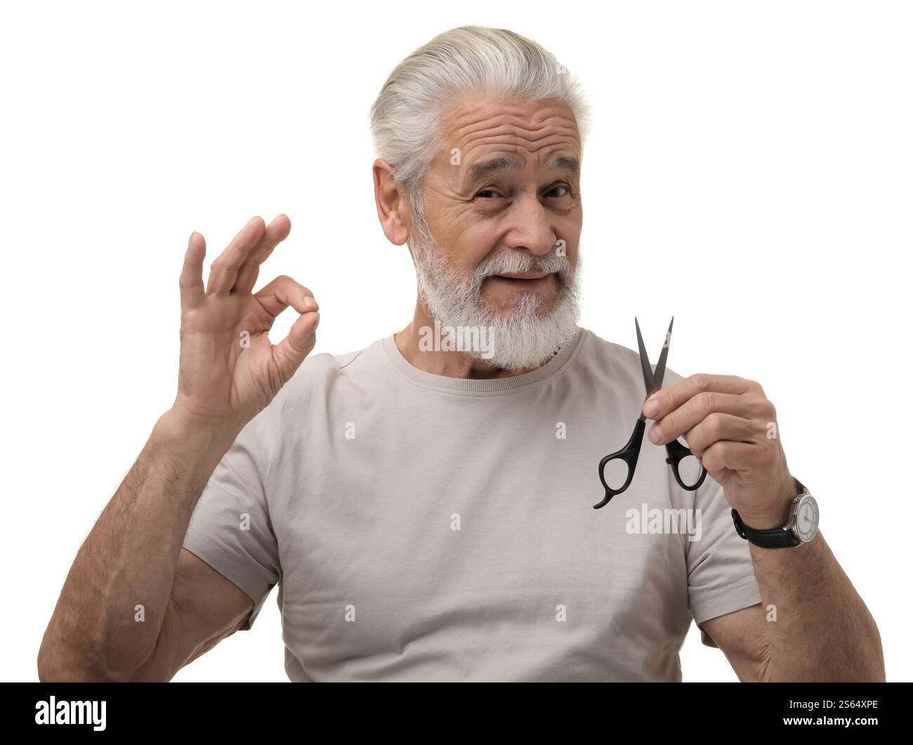 Bearded senior man with scissors showing ok gesture on white background ...