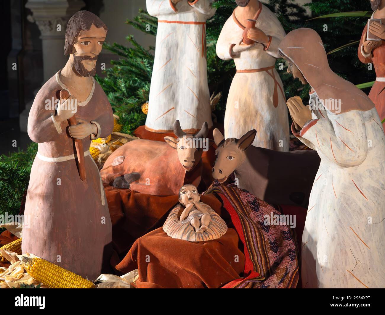 A detailed nativity scene with clay figures depicting the birth of ...