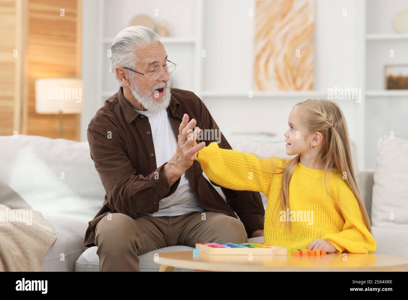 Elderly man giving math hi-res stock photography and images - Alamy