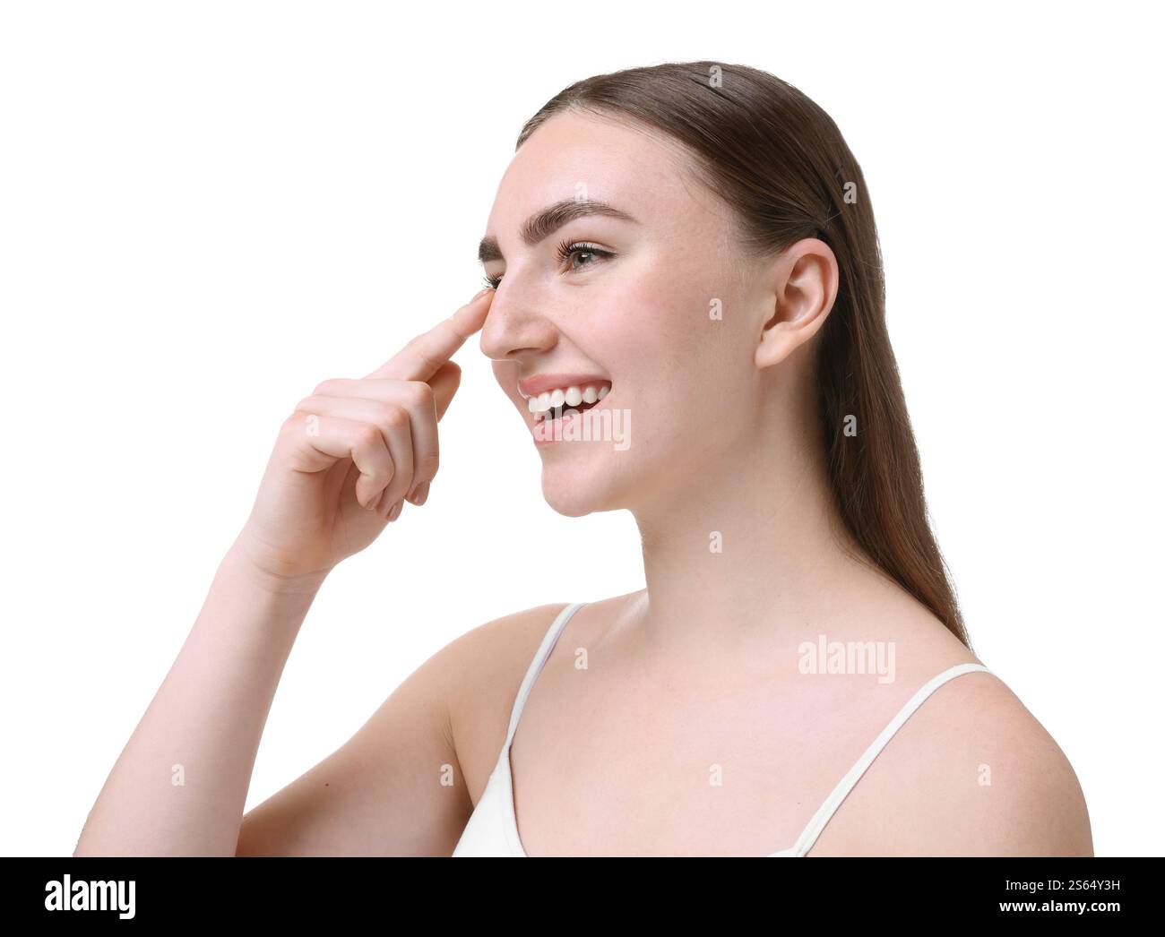 Woman touching her nose on white background Stock Photo - Alamy