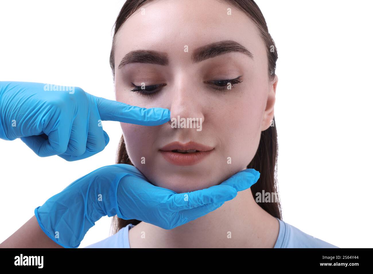 Doctor checking patient's nose before plastic surgery operation on ...