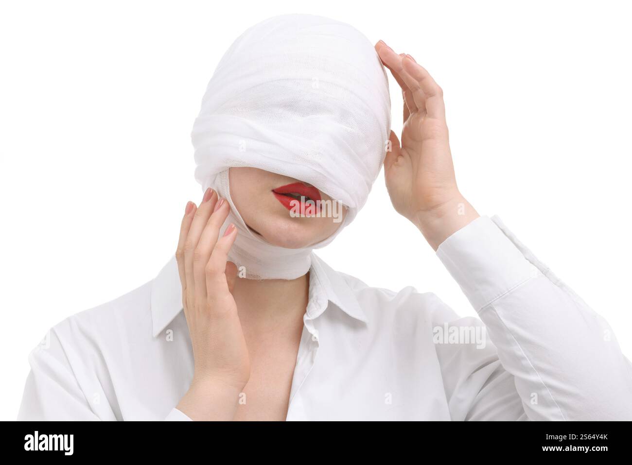 Woman with face wrapped in medical bandage after plastic surgery ...