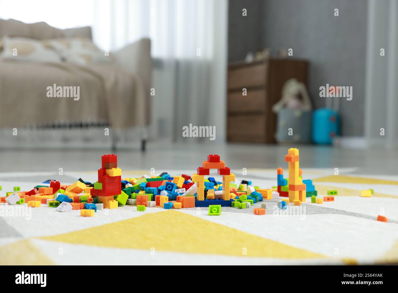 Construction toy. Figures made with building bricks and colorful blocks ...