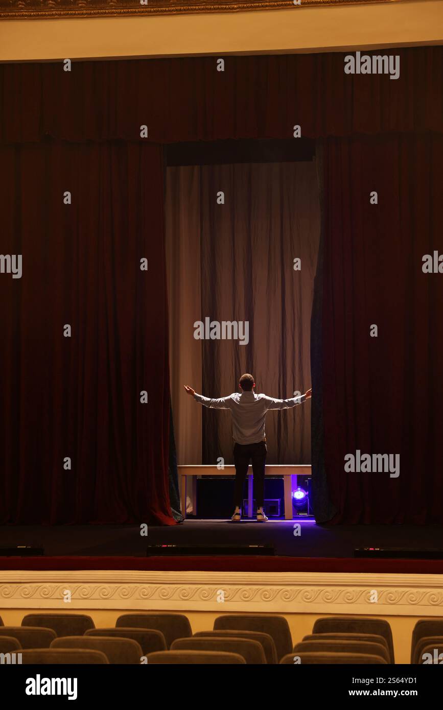 Professional actor rehearsing on stage in theatre, back view Stock ...
