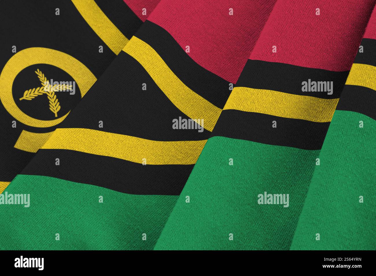 Vanuatu flag with big folds waving close up under the studio light ...