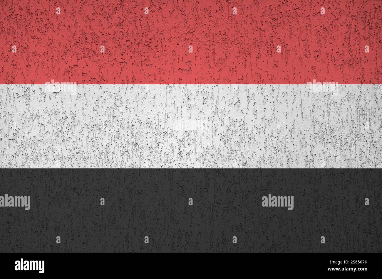 Yemen flag depicted in bright paint colors on old relief plastering ...