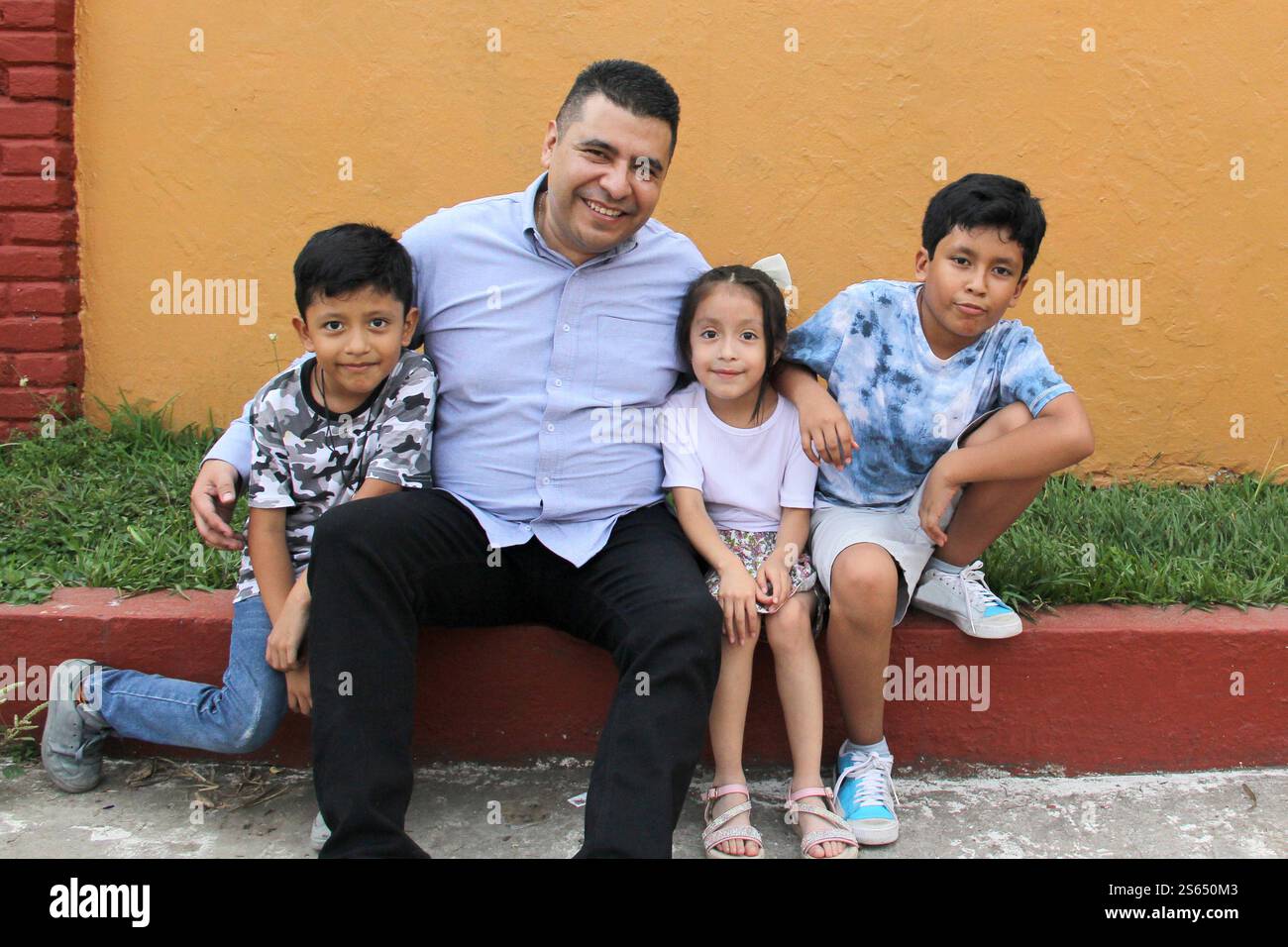 Single Dad with two brown latino sons and daughter spend time together ...