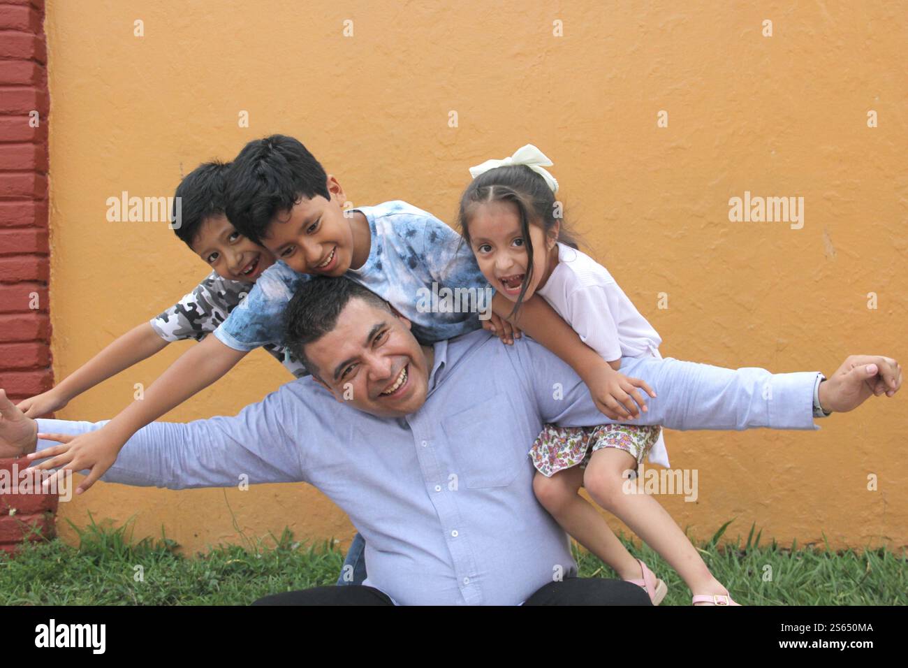 Single Dad with two brown latino sons and daughter spend time together ...