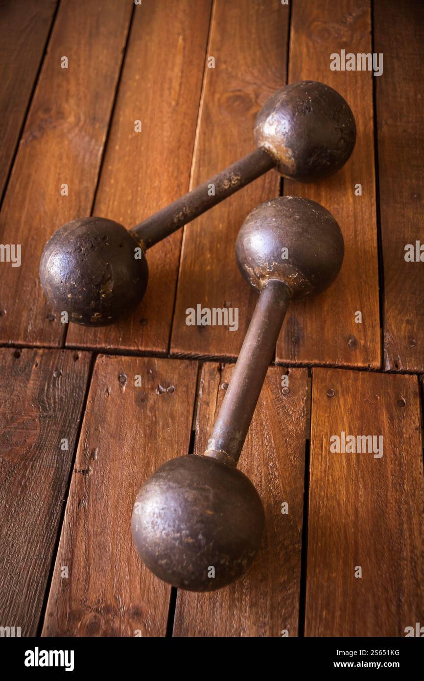 Old rusty dumbbells on rustic wood board background texture Stock Photo ...