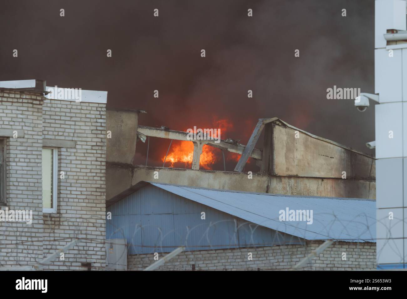 Massive large blaze fire in the city, blazing warehouse factory ...