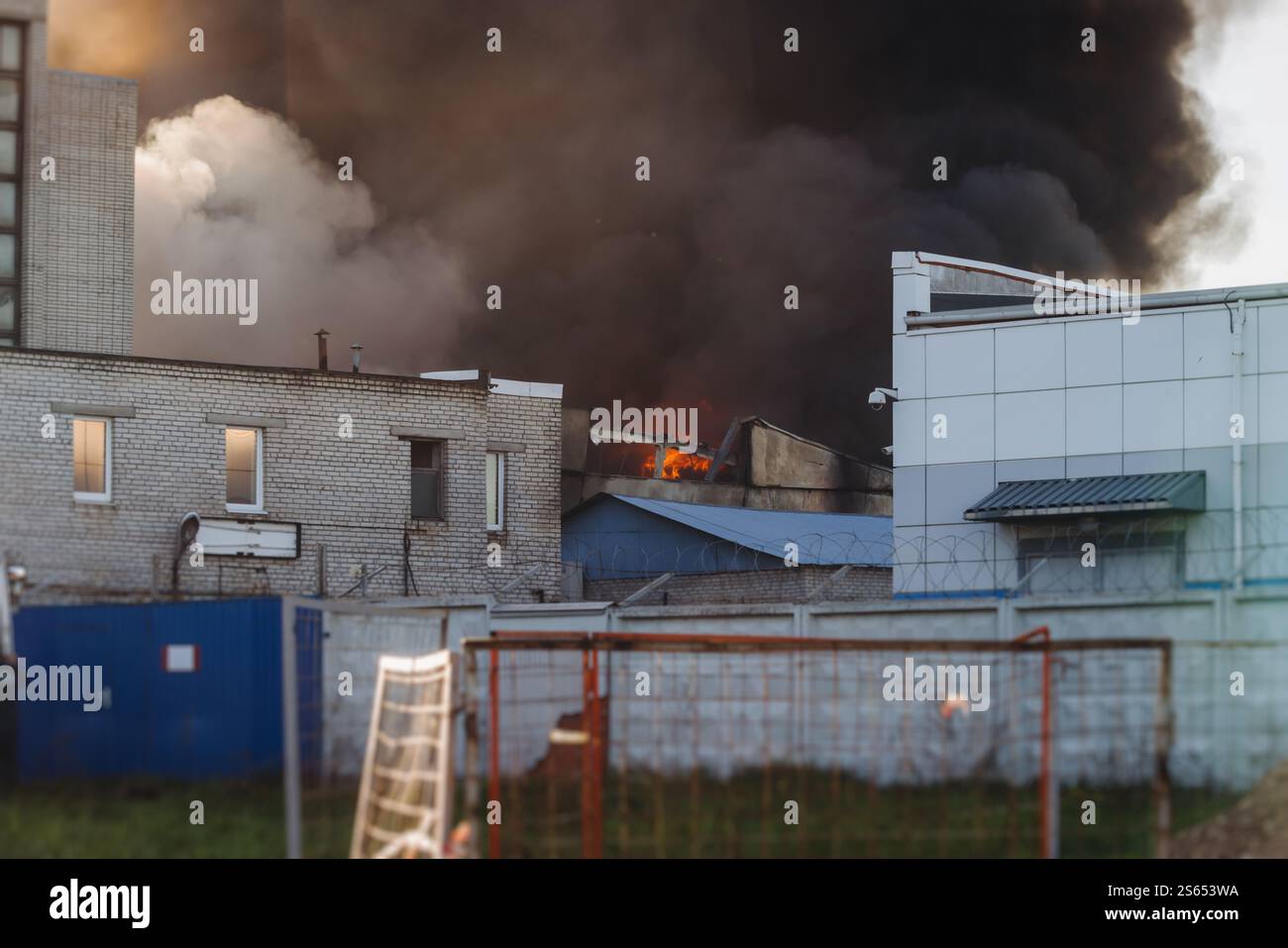 Massive large blaze fire in the city, blazing warehouse factory ...
