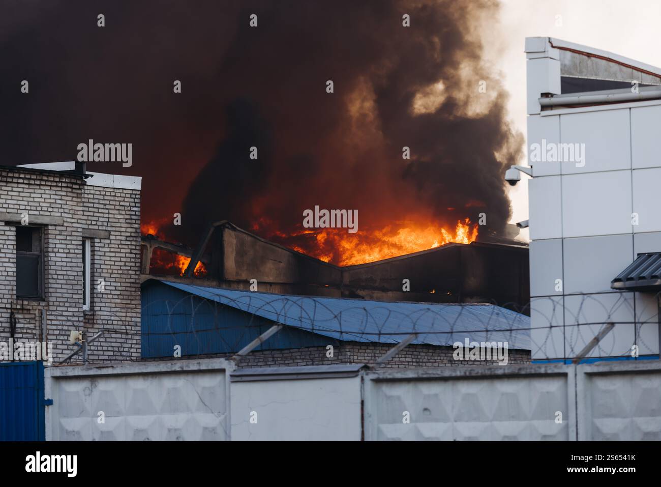 Massive large blaze fire in the city, blazing warehouse factory ...