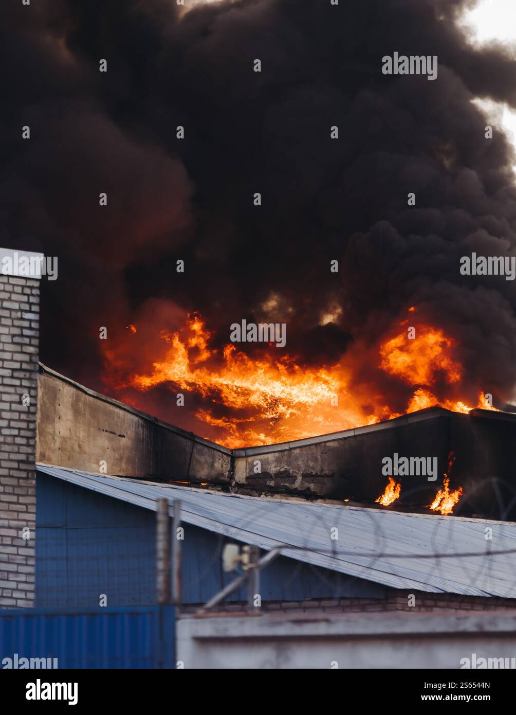 Massive large blaze fire in the city, blazing warehouse factory ...