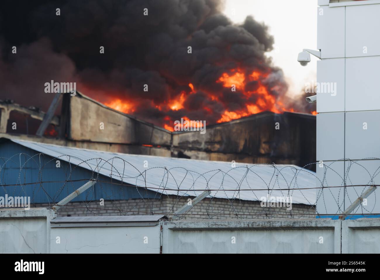 Massive large blaze fire in the city, blazing warehouse factory ...