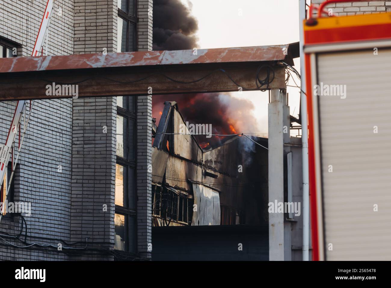 Massive large blaze fire in the city, blazing warehouse factory ...