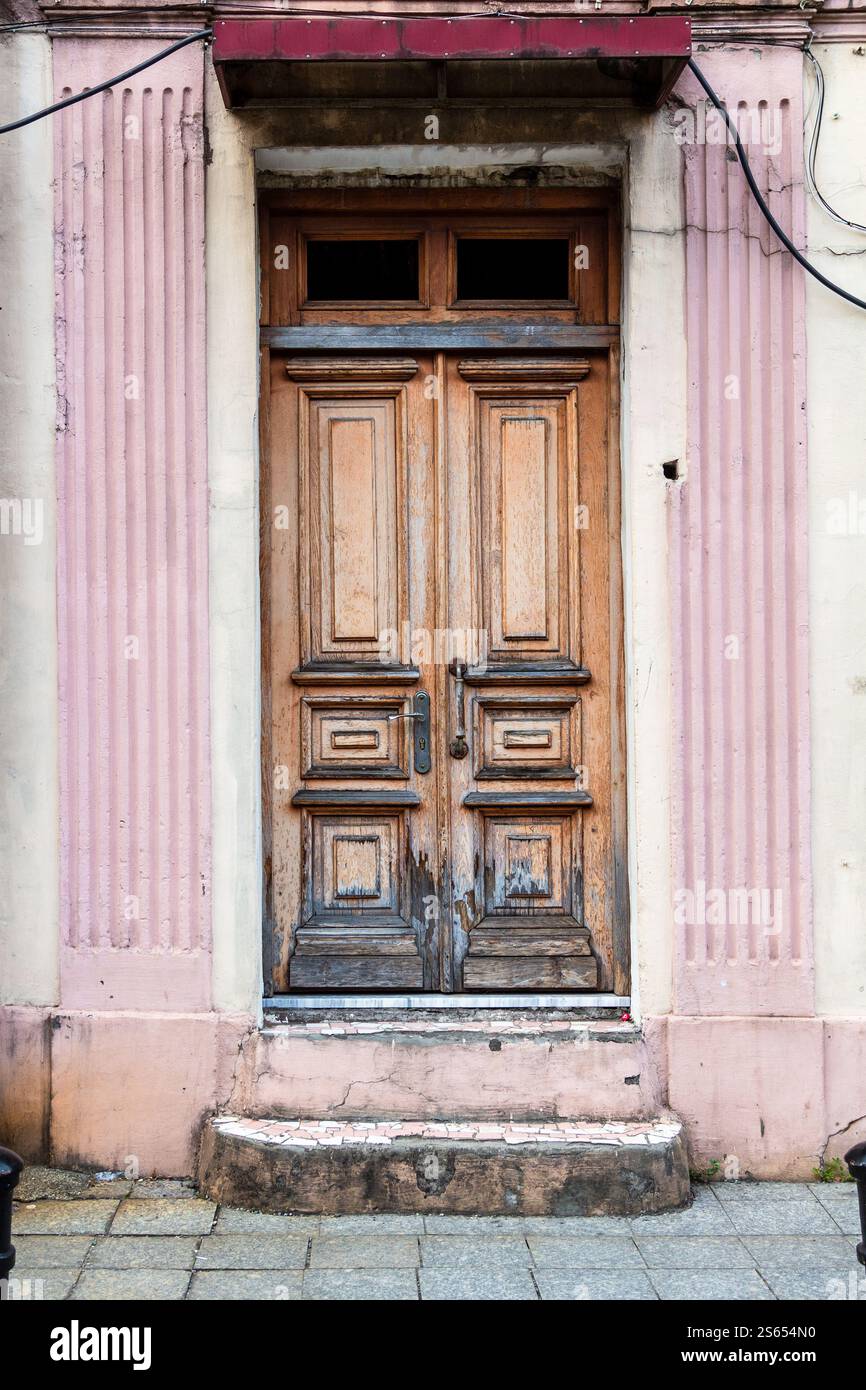 travel to Georgia - old entrance wooden door of urban apartment ...