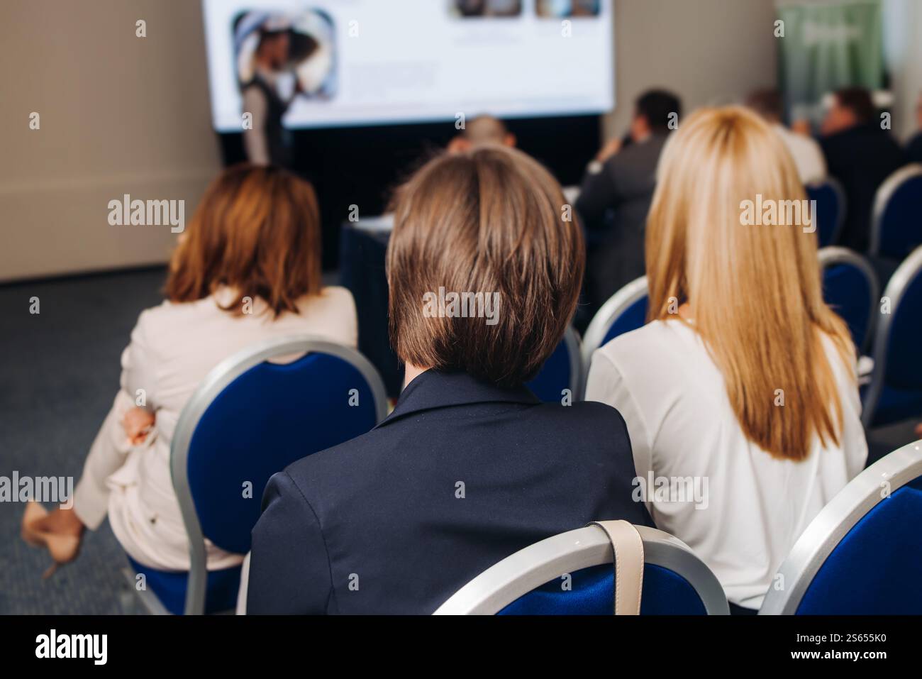 Female participants audience at the symposyum meeting, attendees in ...