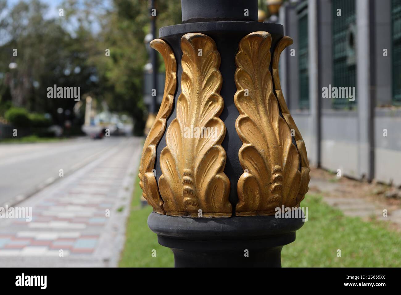 ornate golden leafy decoration on roadside lamp post Stock Photo - Alamy