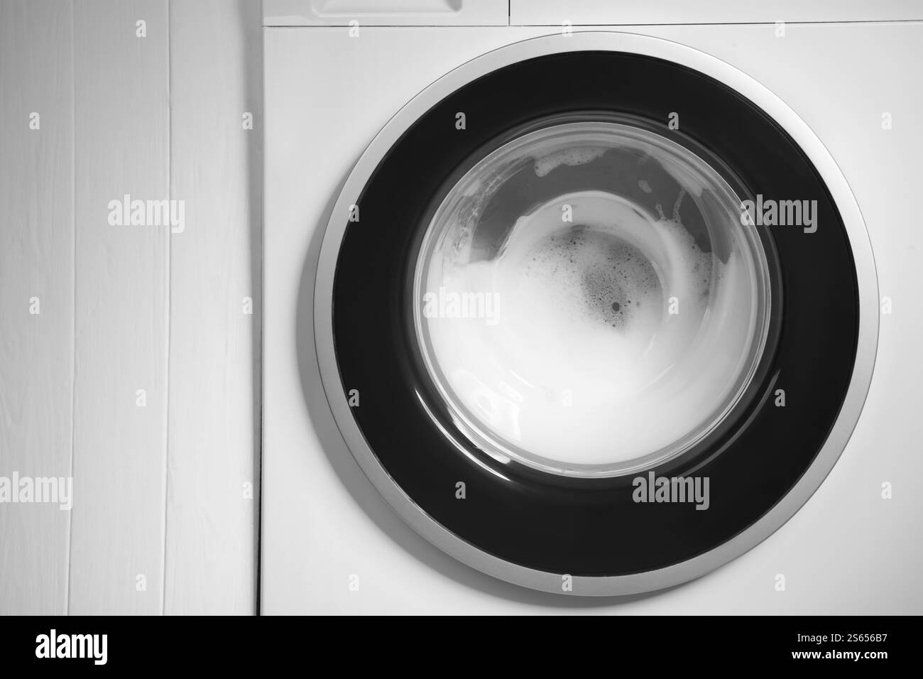 Washing machine with suds as background, closeup Stock Photo - Alamy