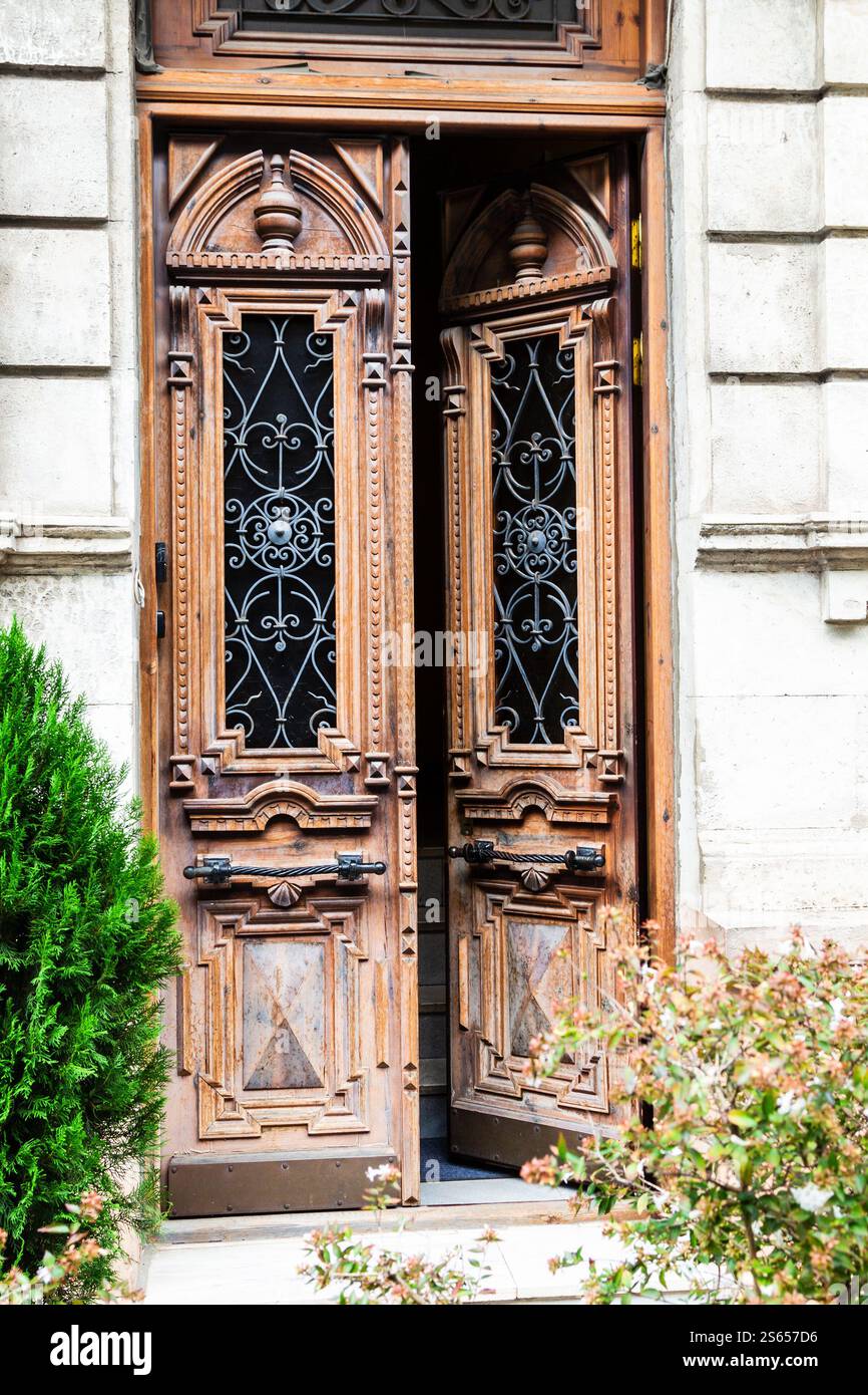 travel to Georgia - open carved wooden entrance door of apartment ...
