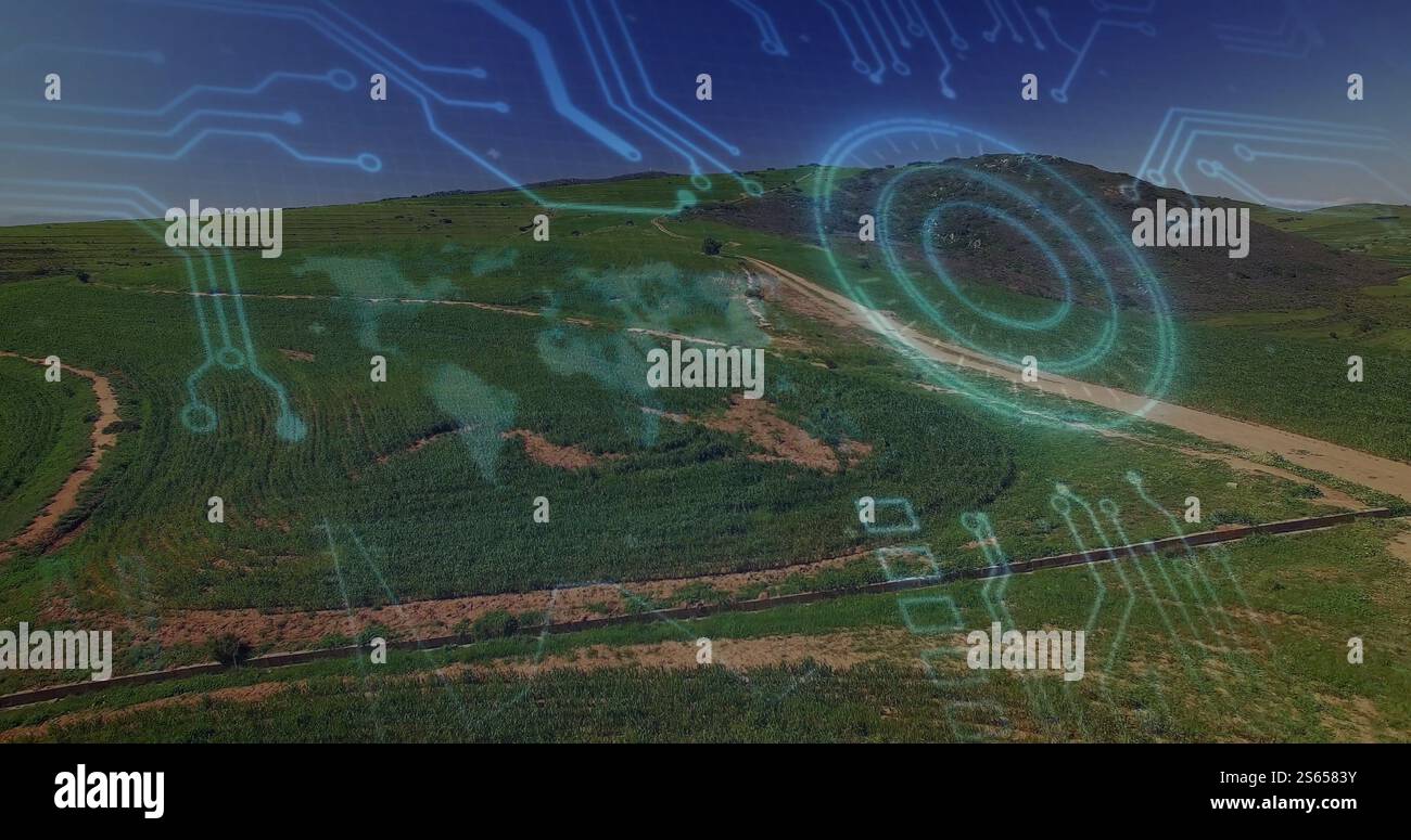 Digital circuit and world map image over aerial view of green landscape. Technology, innovation ...