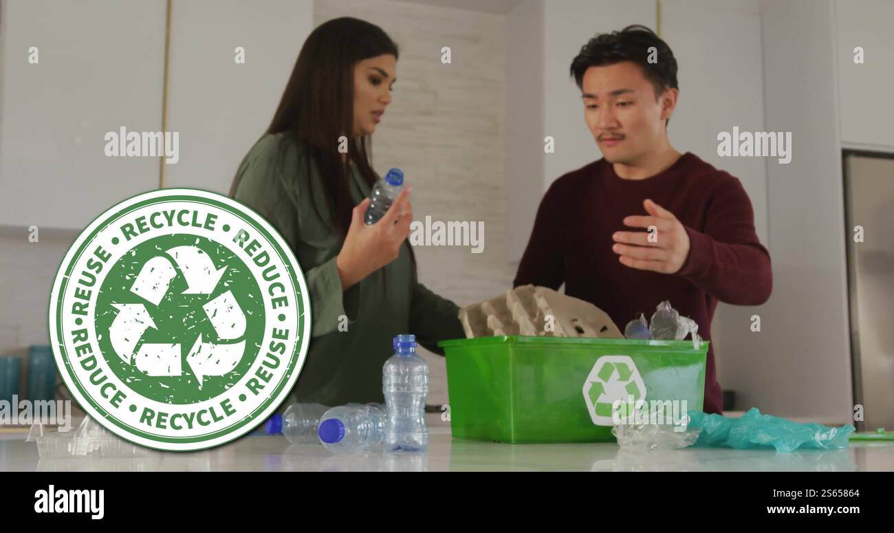 Image of recycle sign over happy diverse couple recycling at home Stock ...