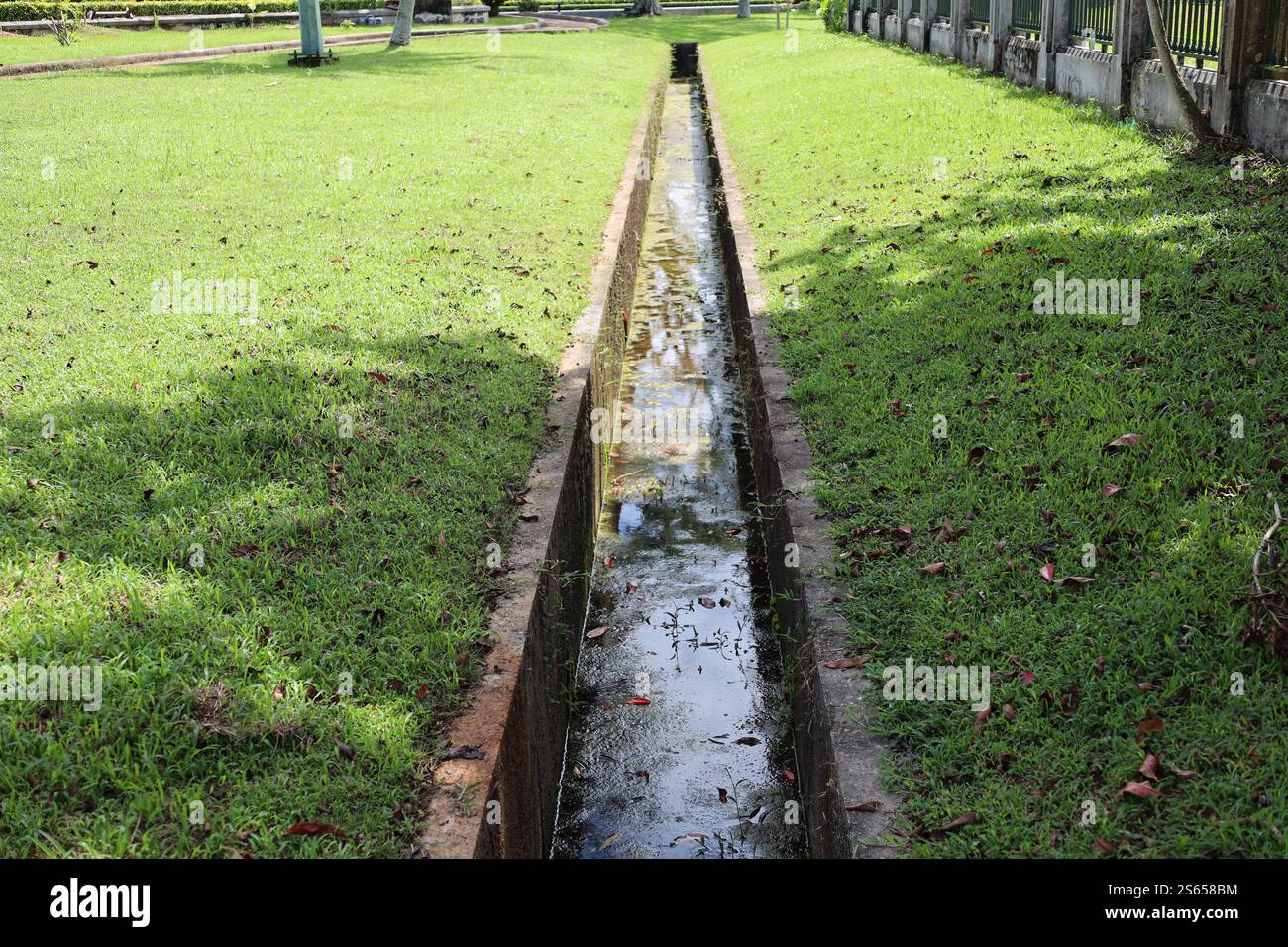 manmade drainage channel through landscaped lawns Stock Photo - Alamy