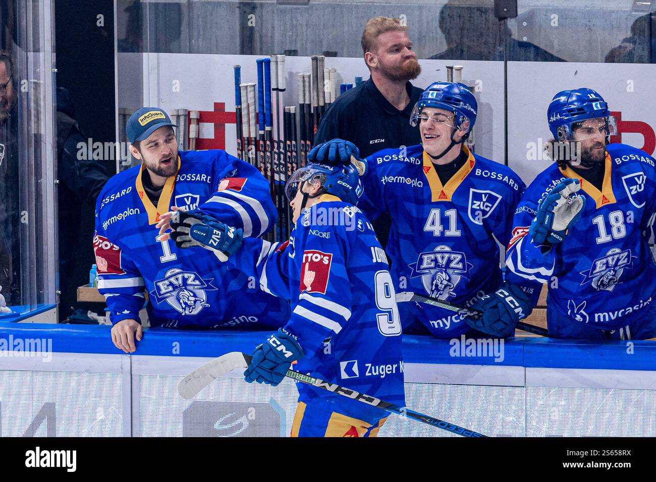 Leon Muggli #41 (EV Zug) congratulates Ludvig Johnson #97 (EV Zug) on ...