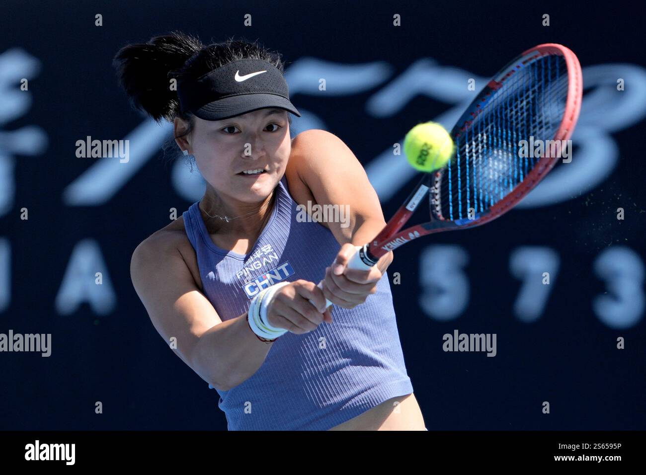 Wang Yafan of China plays a backhand return to Daria Kasatkina of ...