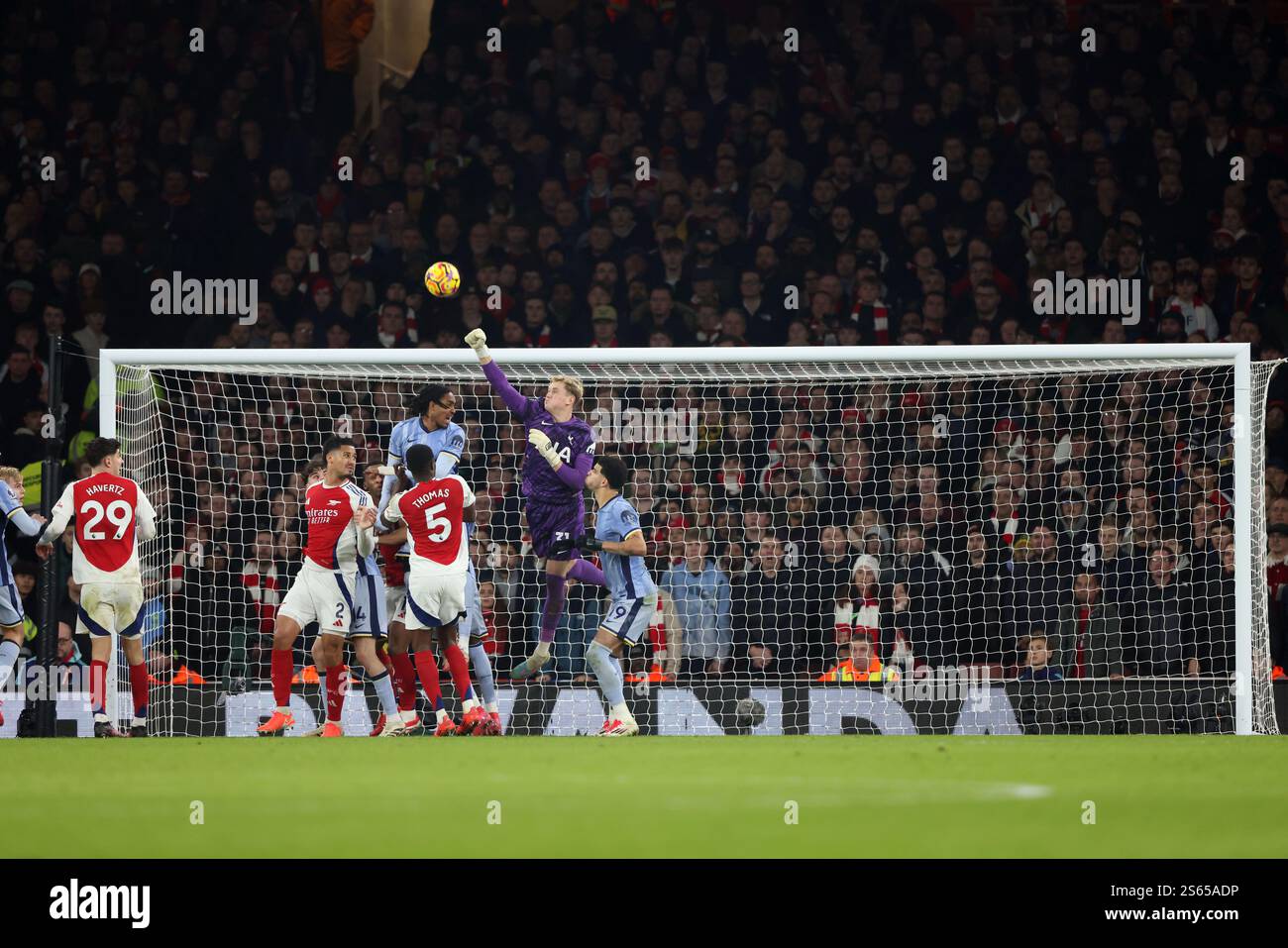 London, UK. 15th Jan, 2025. Antonin Kinsky (TH) punches clear at the ...