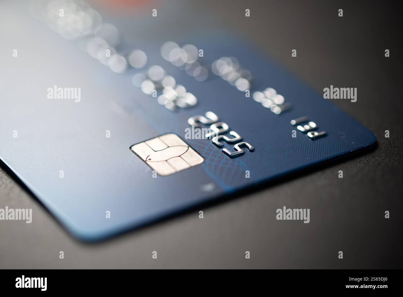 Macro low key credit card or debit card background with selective focus ...