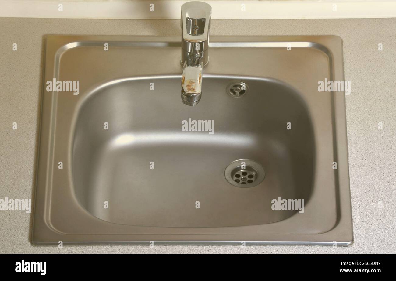 Sink with silver faucet. Built-In domestic kitchen appliances. New ...