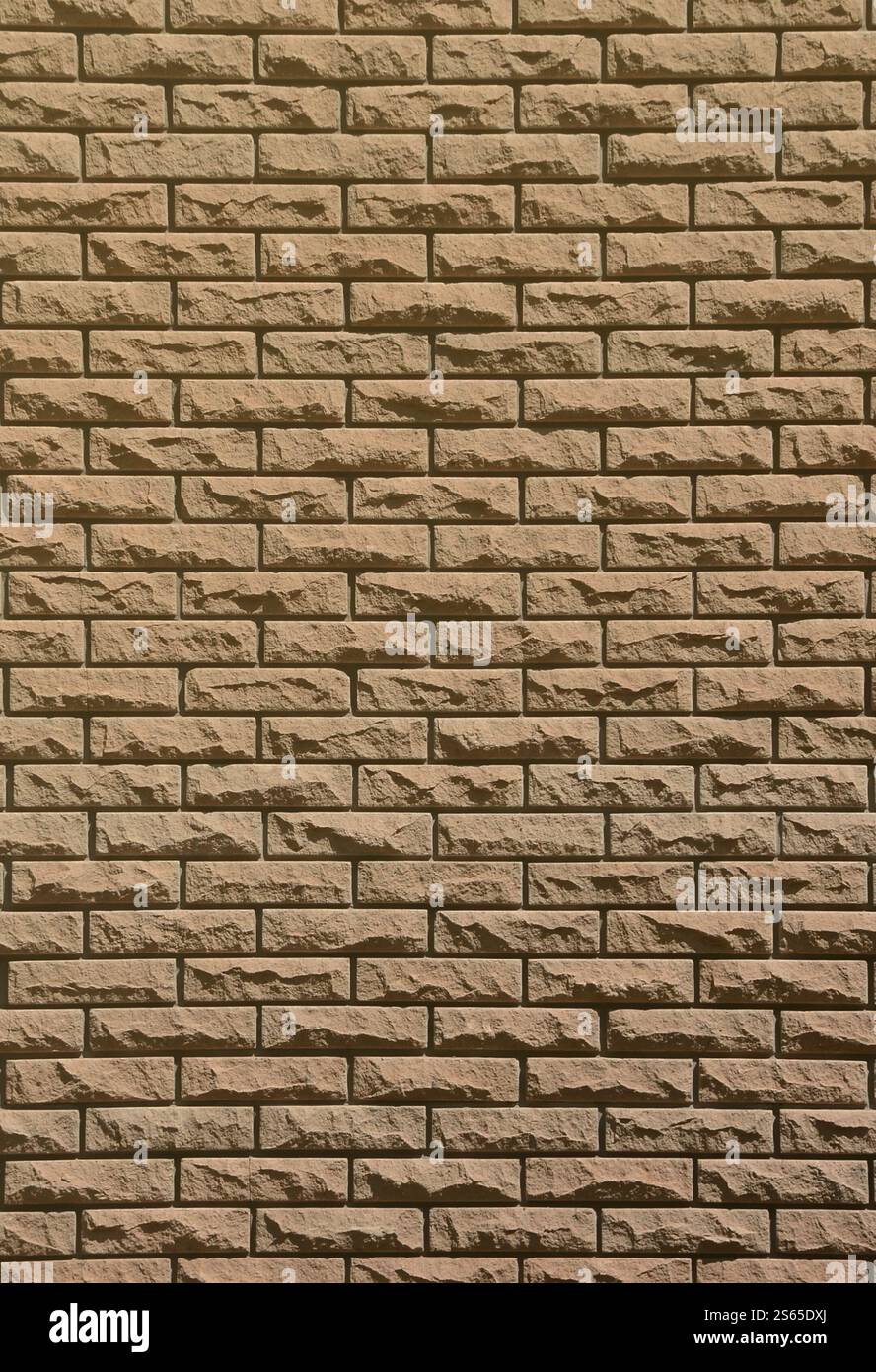Texture of brick wall from relief stones under bright sunlight Stock ...