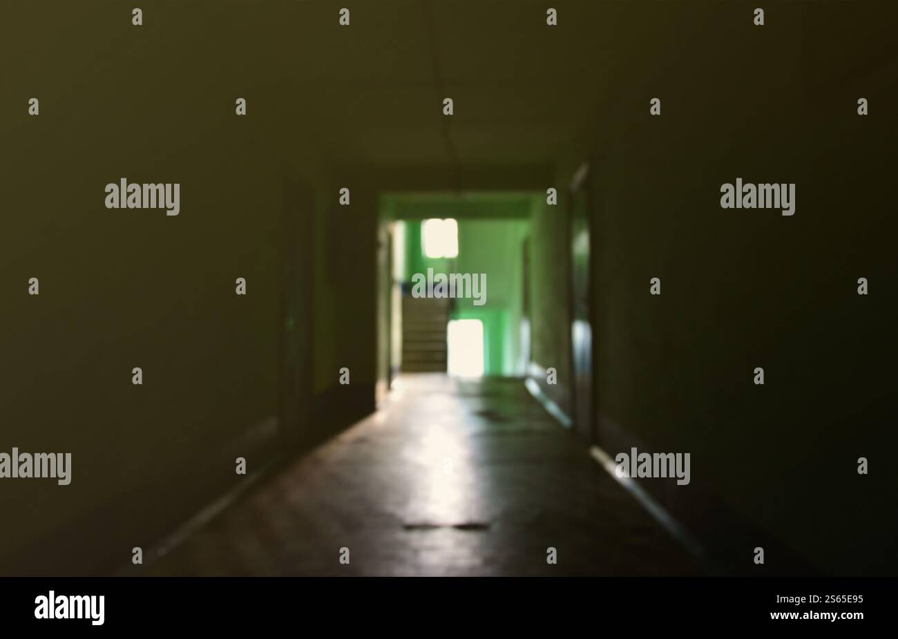 The blurred image of gloomy corridor of a neglected public building ...