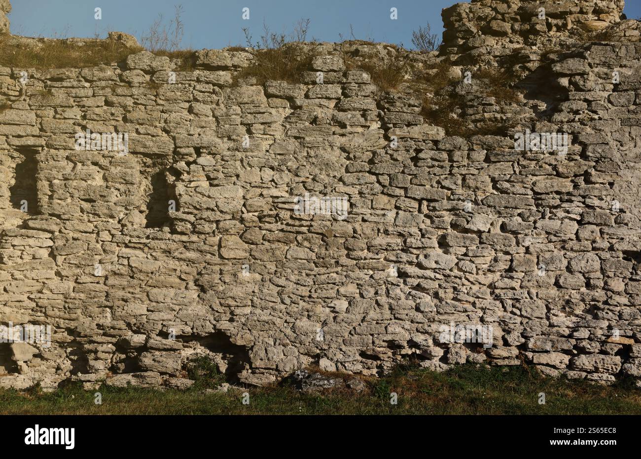 Very old brick stone wall of castle or fortress of 18th century. Full ...