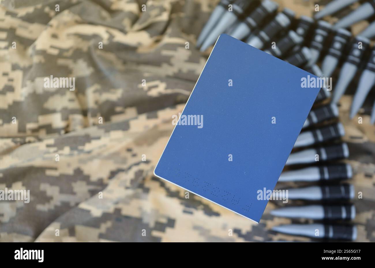 Ukrainian foreign passport on fabric with texture of military pixeled ...